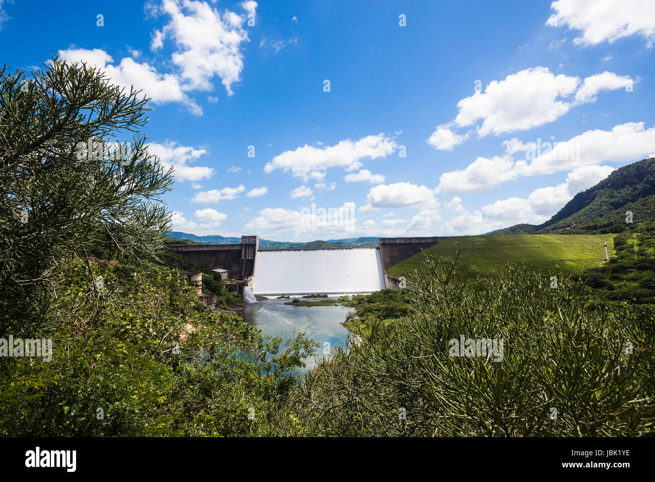 Inanda Dam fill to capacity and water flowing over the high wall Stock ...