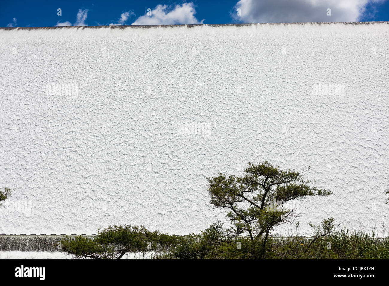 Inanda Dam fill to capacity and water flowing over the high wall Stock ...