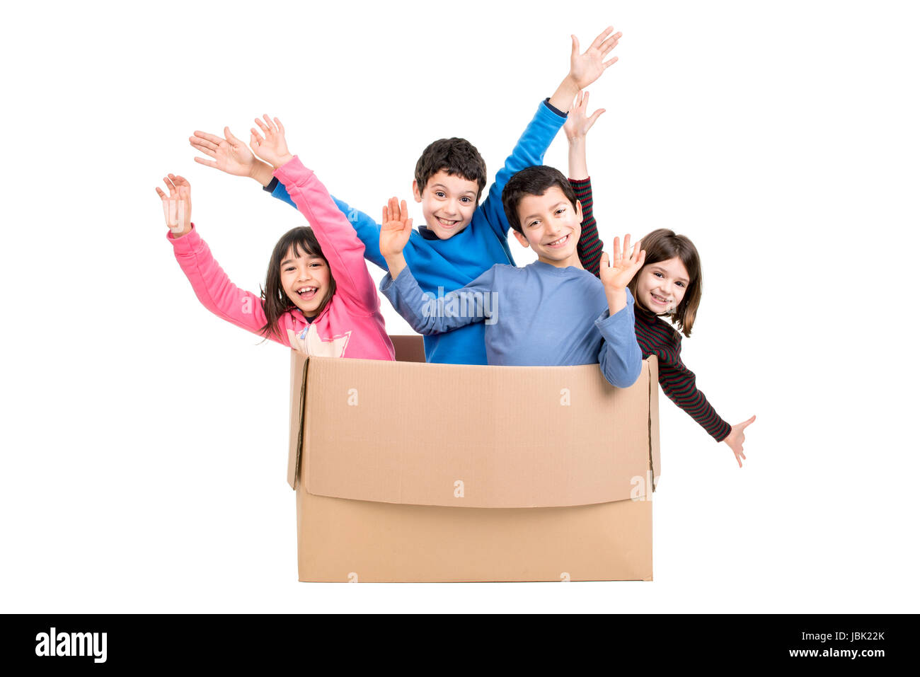 Happy kids inside a cardboard box isolated in white Stock Photo - Alamy