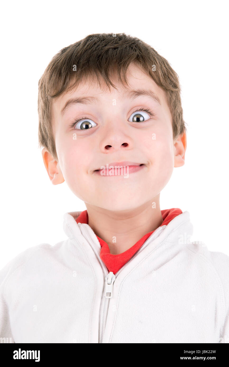 Young boy making faces isolated in white Stock Photo - Alamy