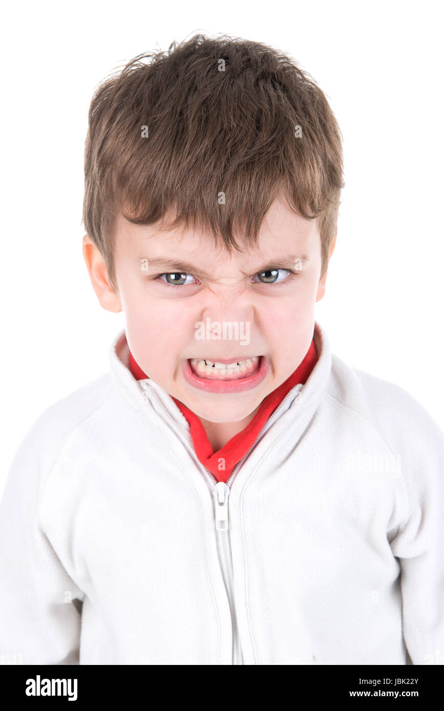 Young boy making faces isolated in white Stock Photo - Alamy
