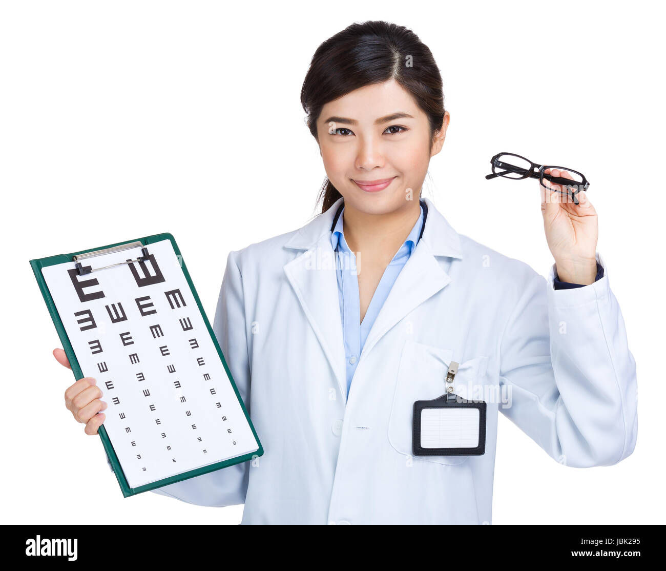 Optometrist showing eye exam chart and holding glasses Stock Photo - Alamy