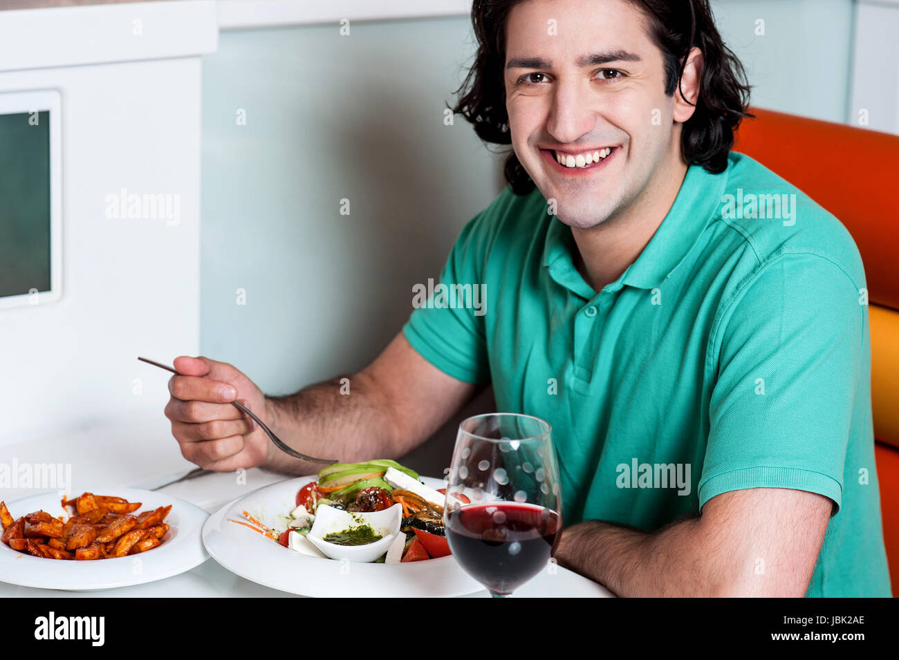 Handsome male enjoying his delicious meal Stock Photo - Alamy