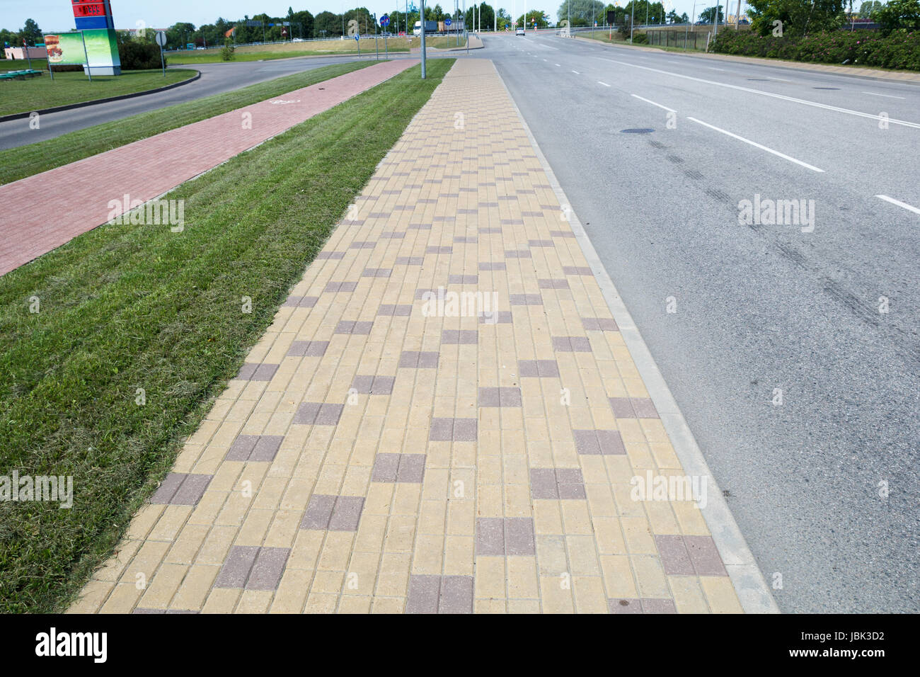 brick paved sideway at side of the street Stock Photo - Alamy