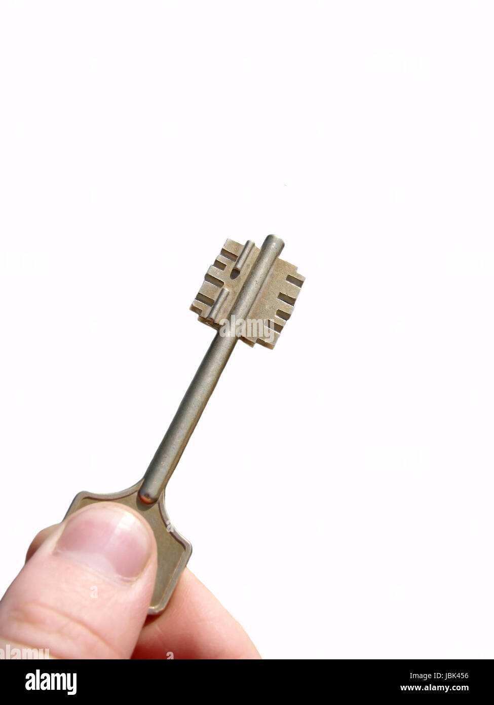 Hand holding the key of success Stock Photo - Alamy