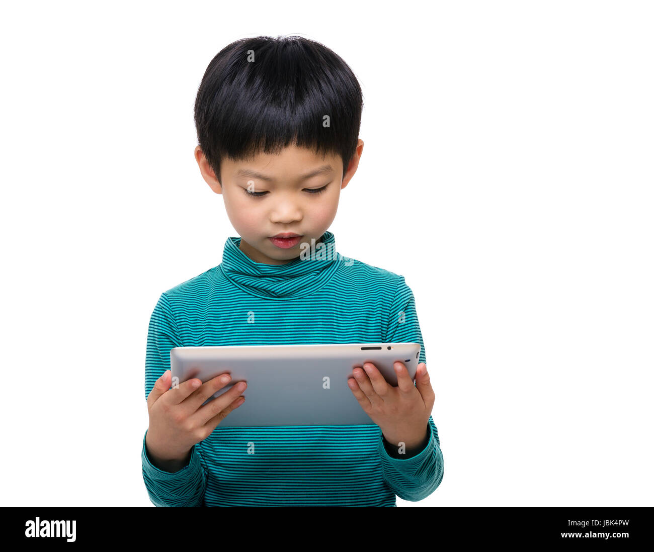 Asian boy using tablet computer Stock Photo - Alamy