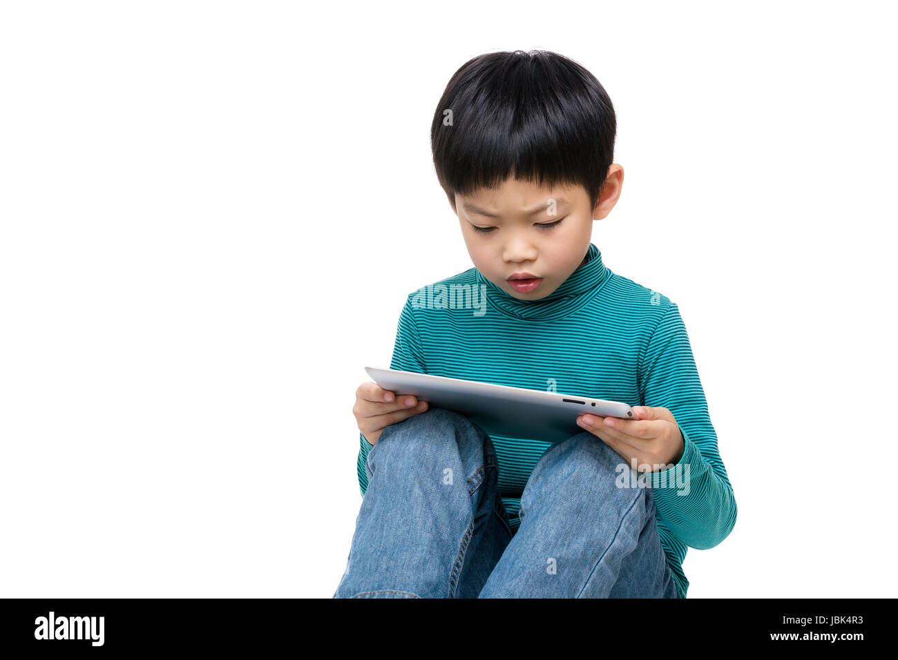 Asian boy using tablet computer Stock Photo - Alamy
