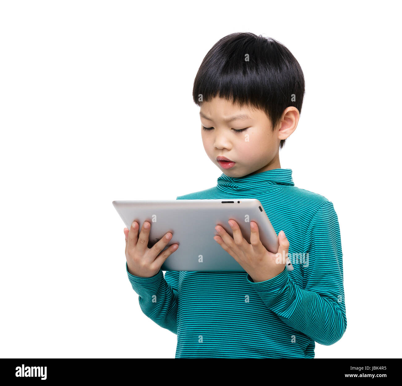 Happy little boy using tablet Stock Photo - Alamy