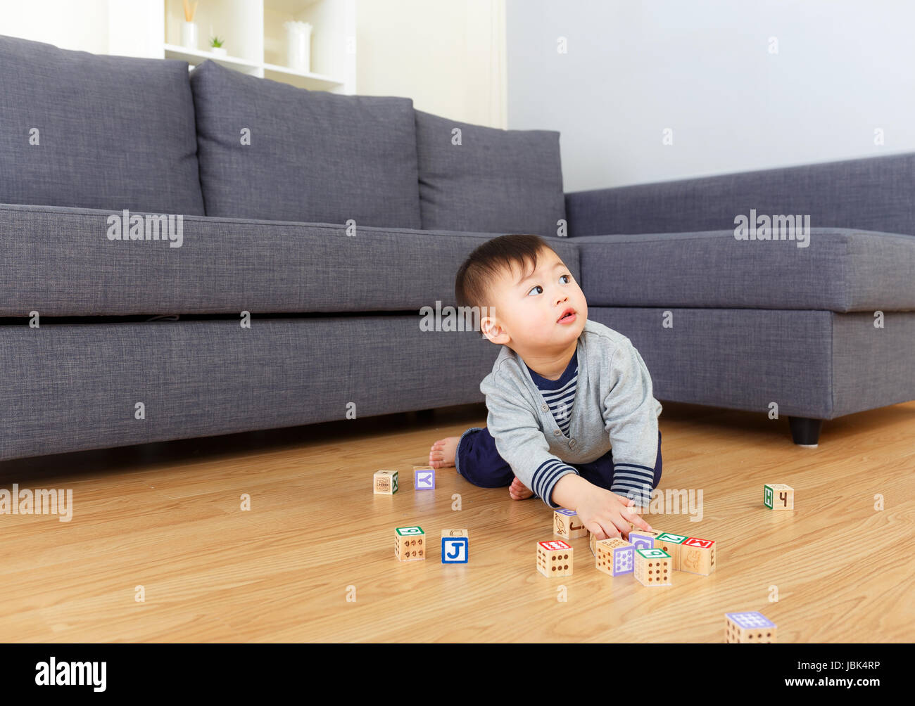 Baby boy creeping at home Stock Photo - Alamy