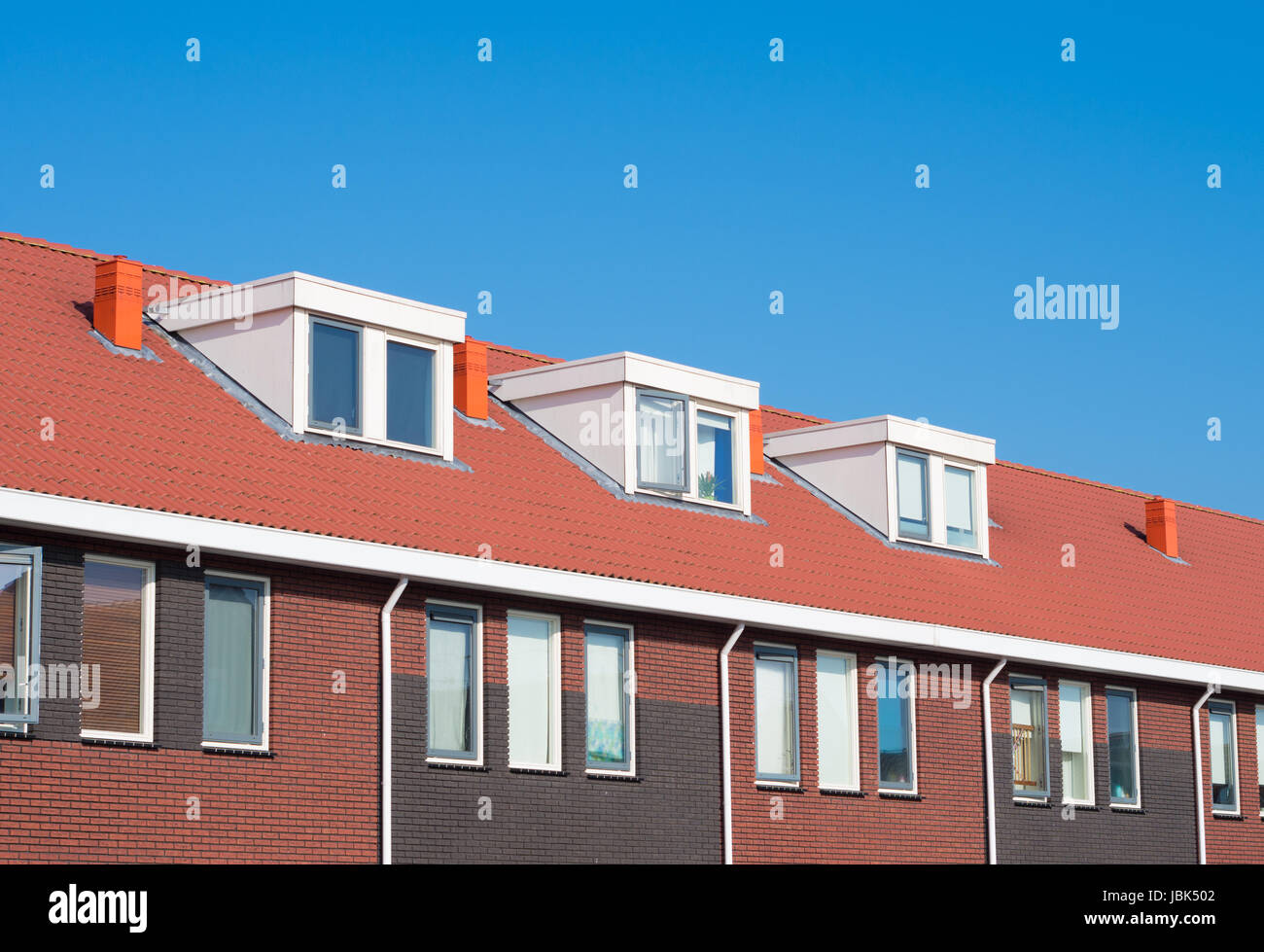 newly build terraced houses with dormer windows Stock Photo - Alamy