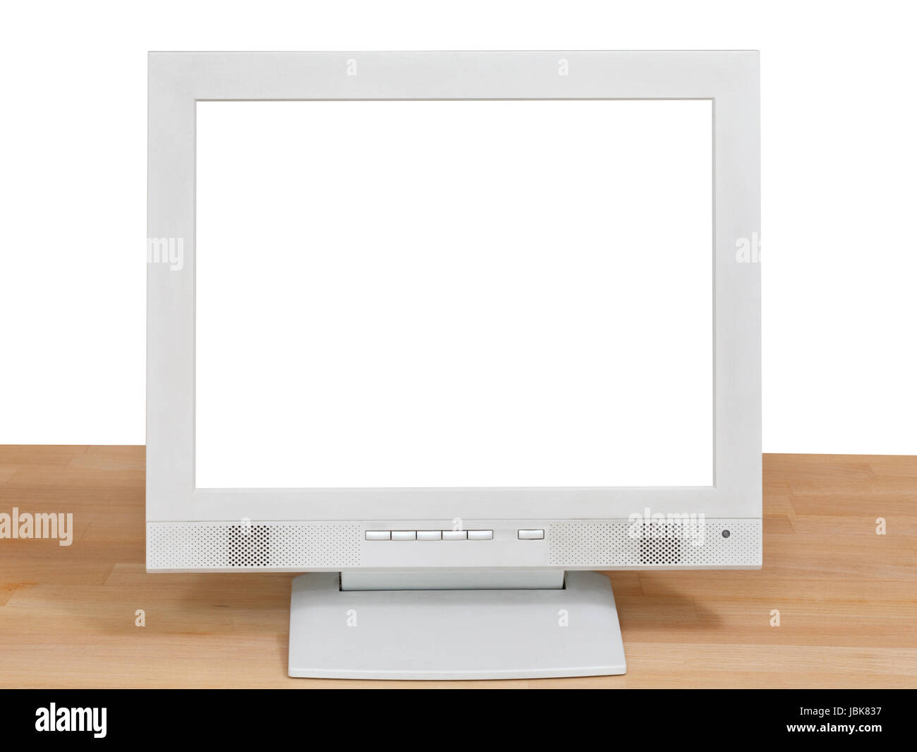 front view of grey computer display with cut out screen on wooden table ...