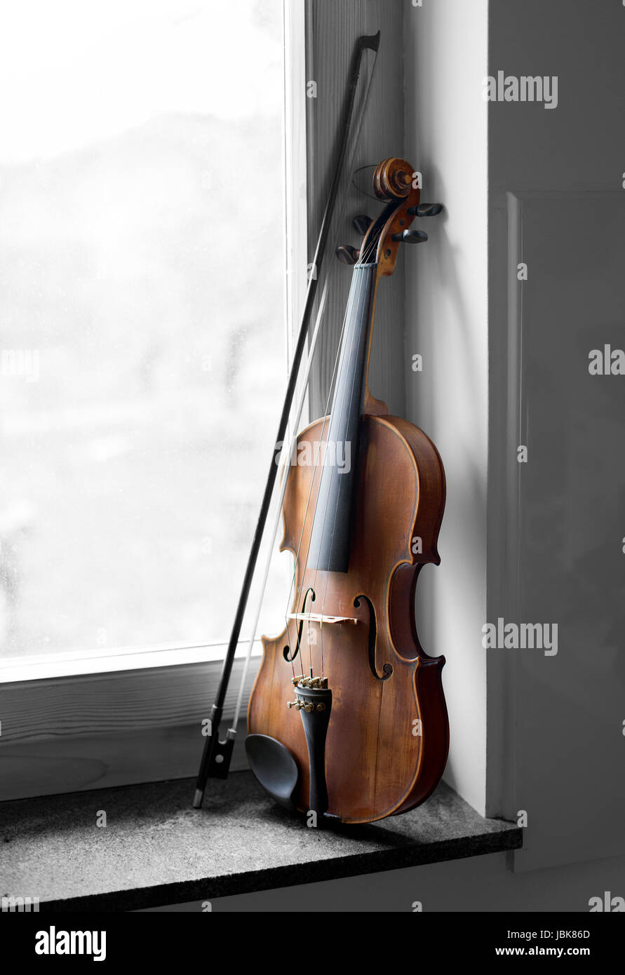 Violin beside window light close up shoot Stock Photo - Alamy