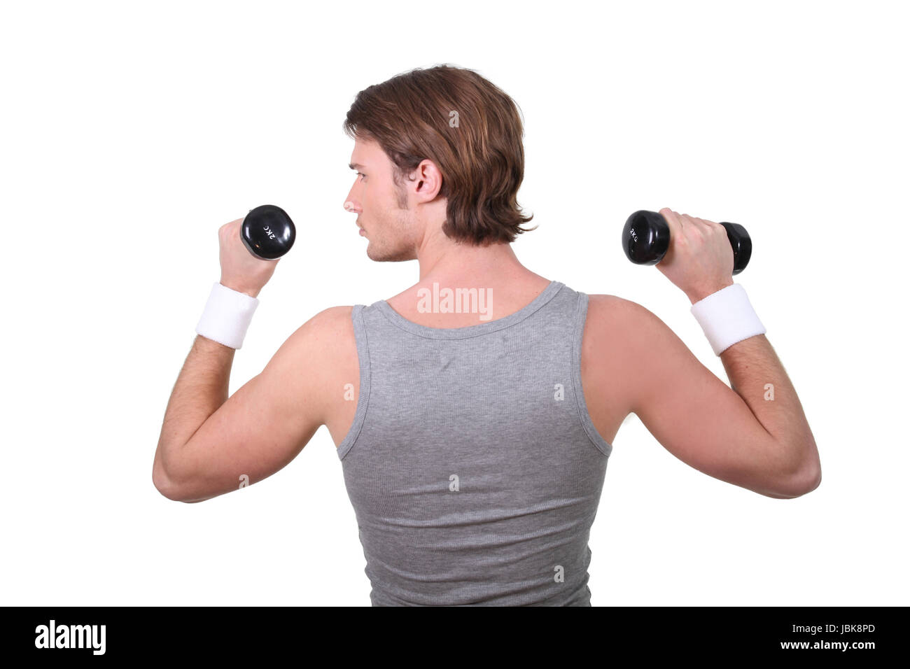Man working out with dumbbells Stock Photo - Alamy