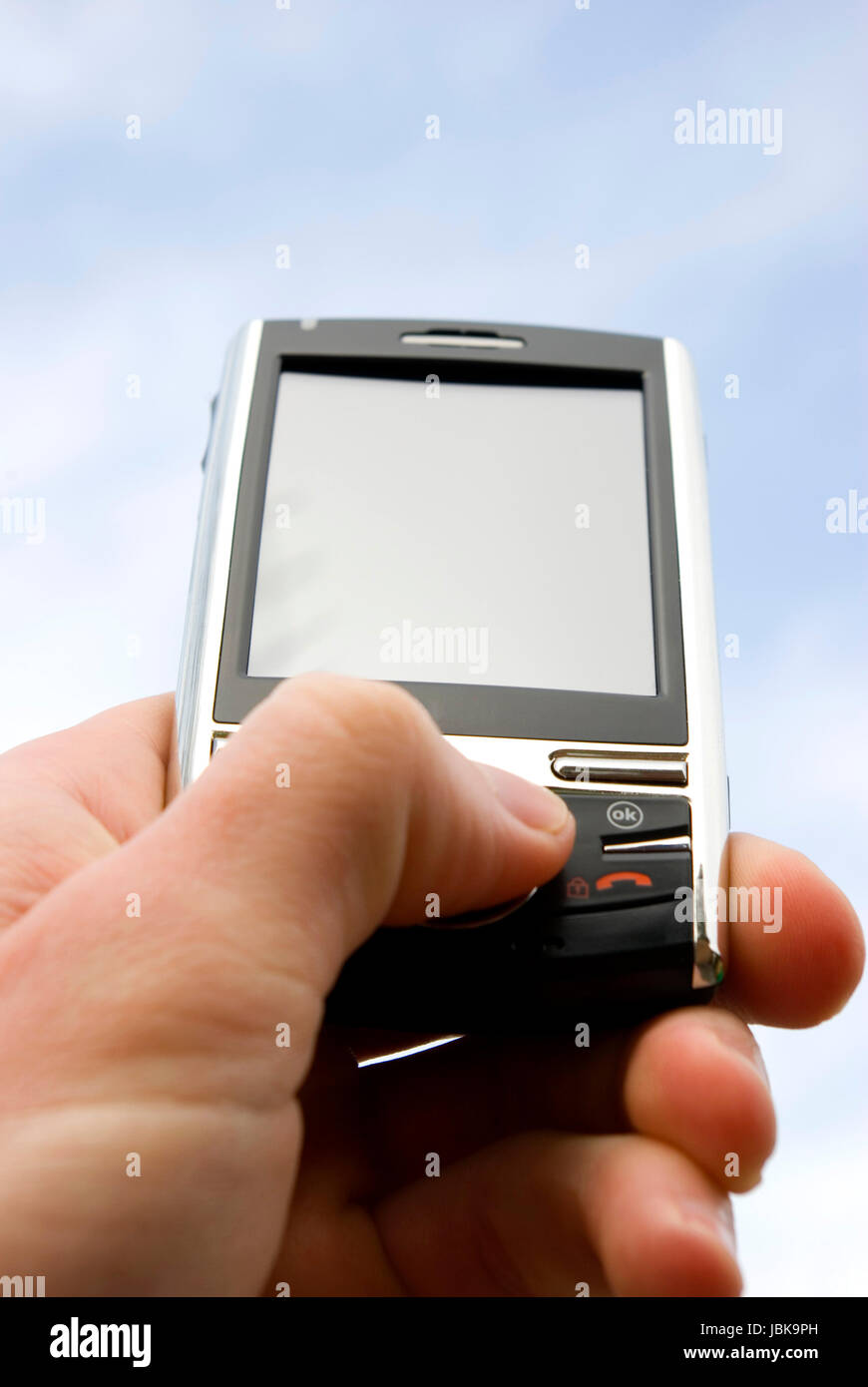 hands with communicator isolated over blue background Stock Photo - Alamy