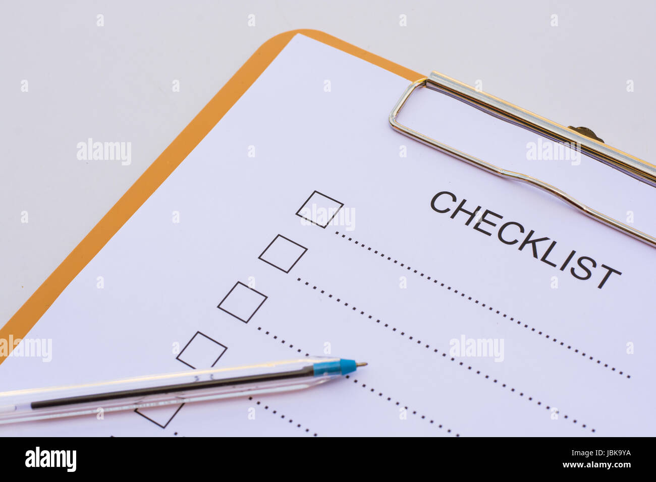 Checklist concept - checklist, paper and a pen with checklist word on ...