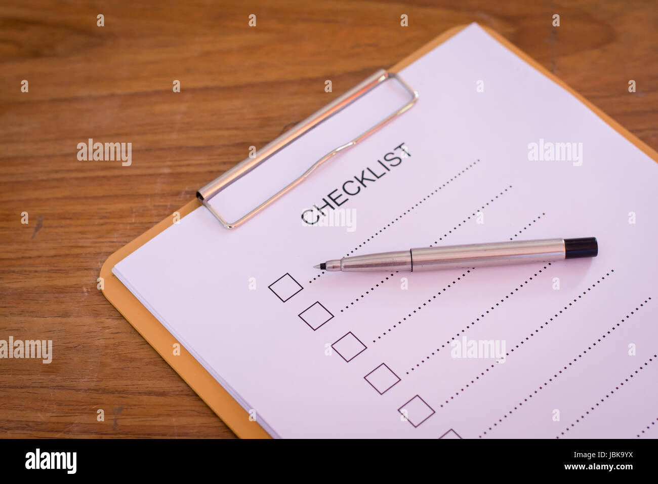 Checklist concept - checklist, paper and a pen with checklist word on ...