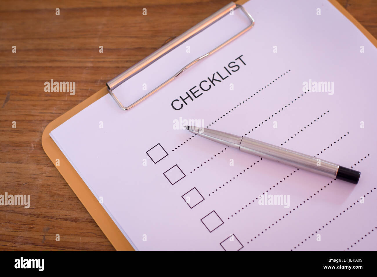 Checklist concept - checklist, paper and a pen with checklist word on ...