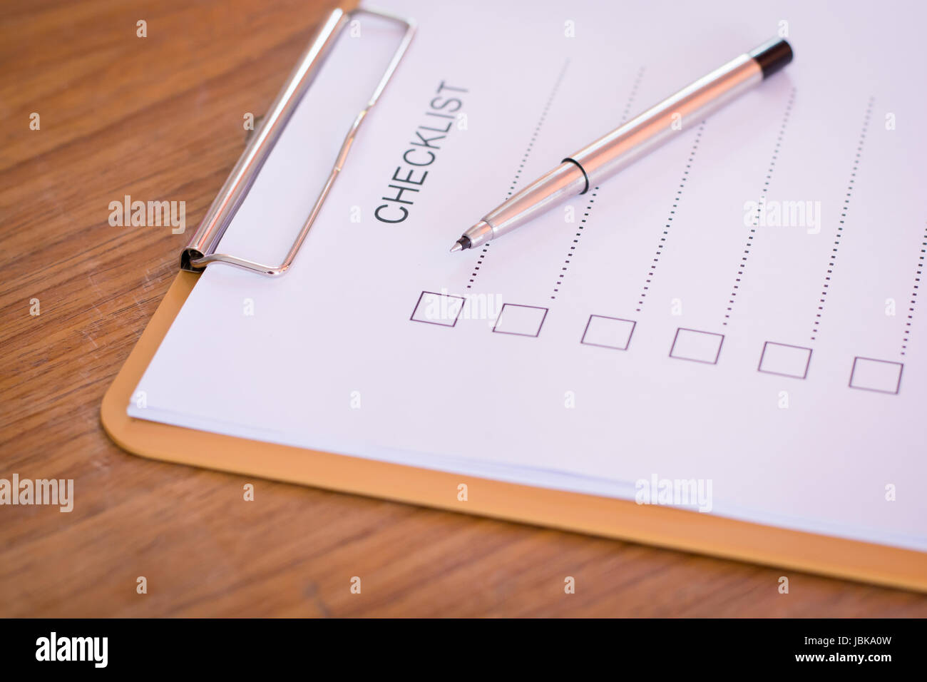 Checklist concept - checklist, paper and a pen with checklist word on ...