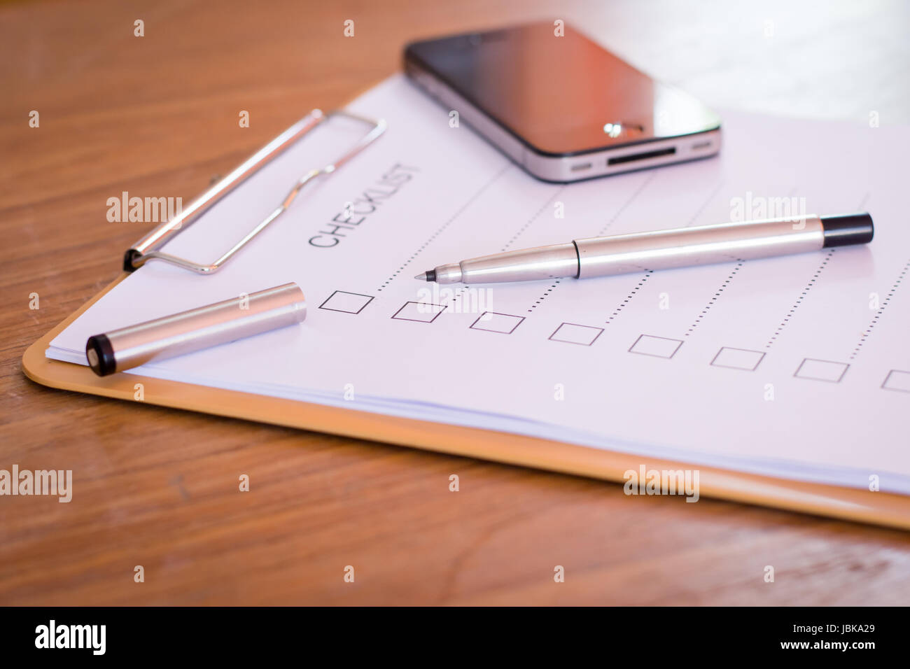 Checklist concept - checklist, paper and a pen with checklist word on ...