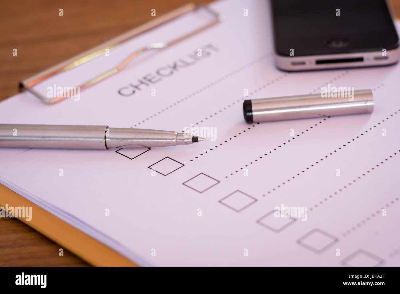 Checklist concept - checklist, paper and a pen with checklist word on ...