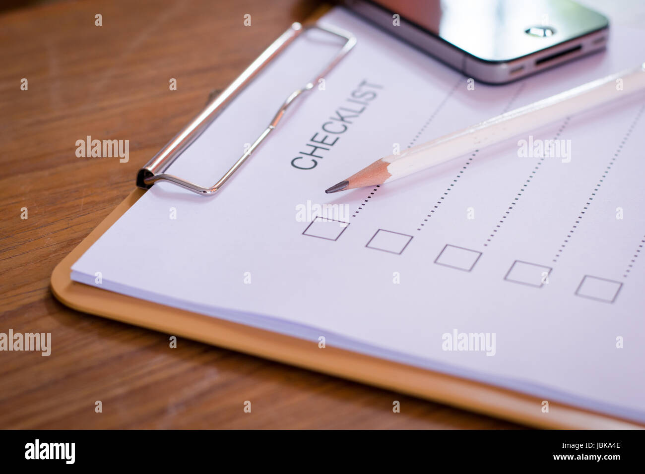 Checklist concept - checklist, paper and a pen with checklist word on ...