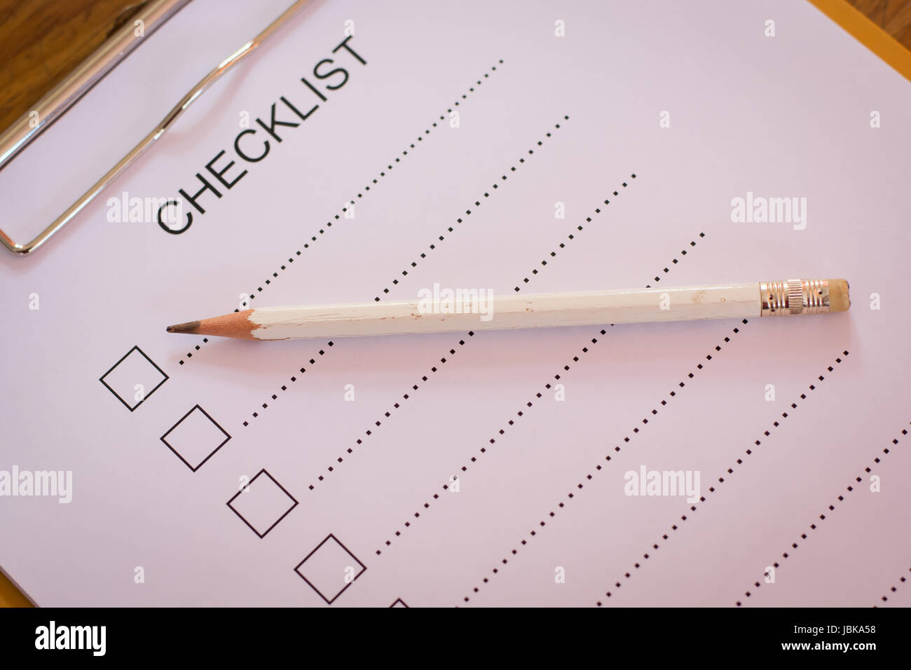 Checklist concept - checklist, paper and a pen with checklist word on ...