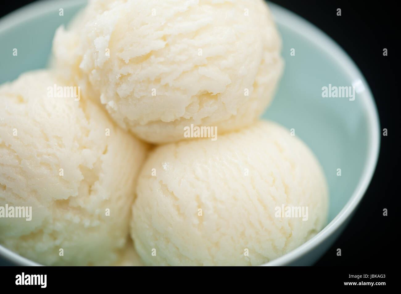Vanilla ice cream cup with wafer over black background Stock Photo - Alamy