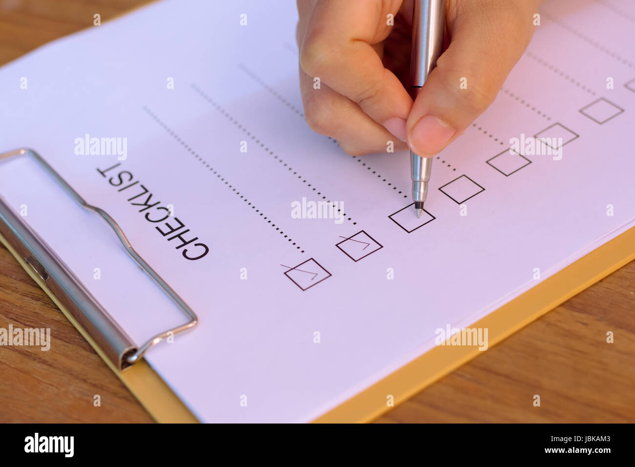 image of businessfemale preparing checklist at office desk Stock Photo ...