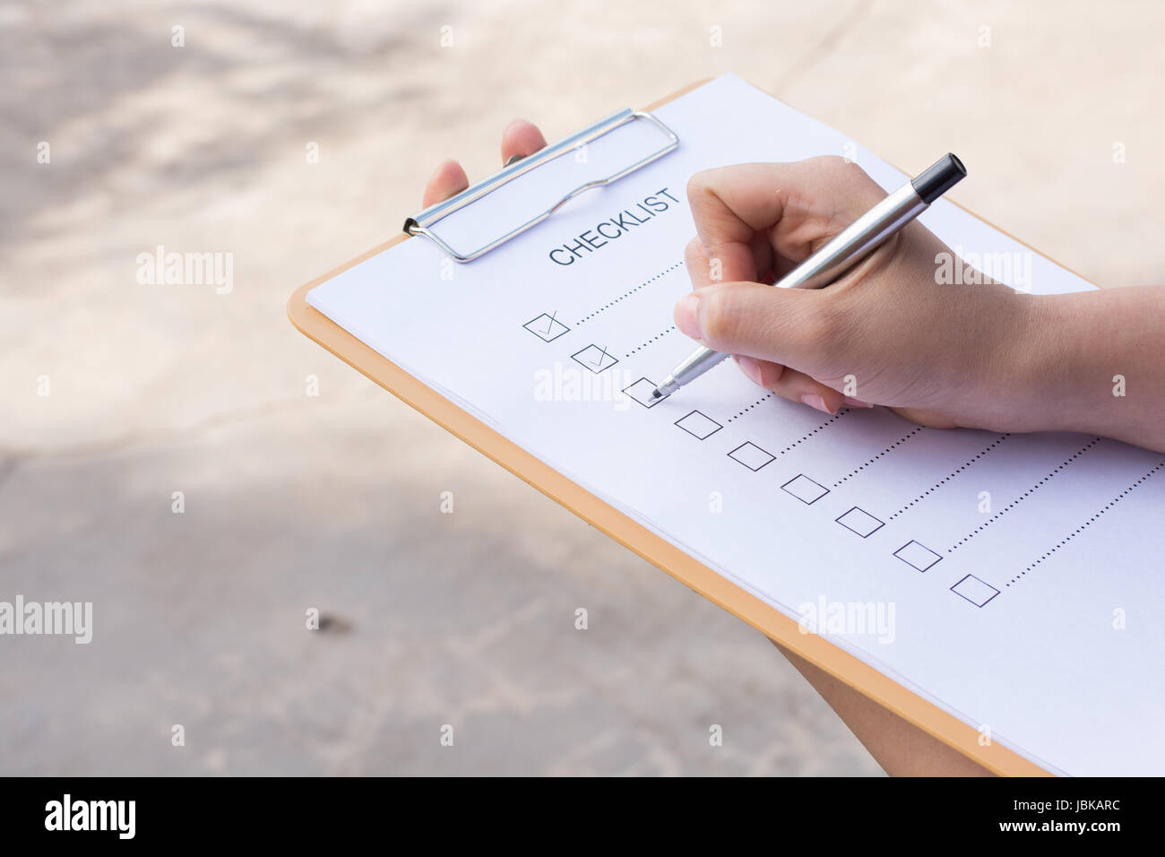 image of businessfemale preparing checklist at office desk Stock Photo ...