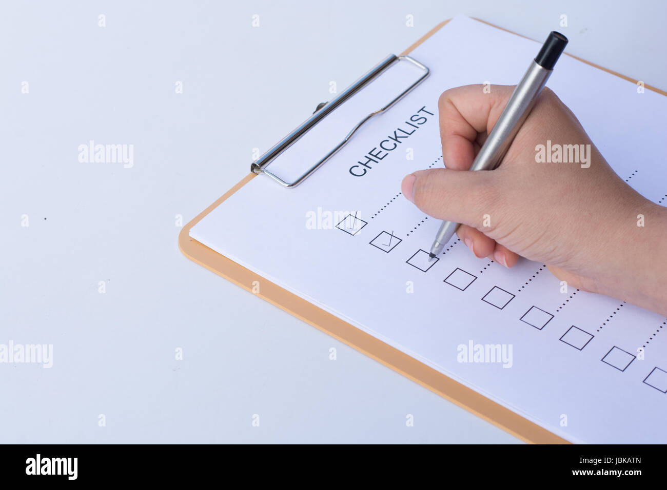 image of businessfemale preparing checklist at office desk Stock Photo ...