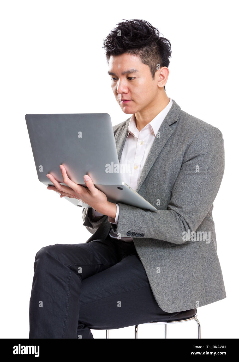 Businessman using laptop Stock Photo - Alamy