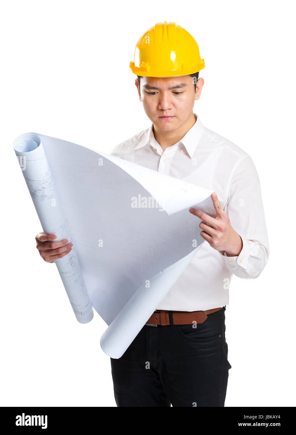 Engineer looking at blueprint Stock Photo - Alamy