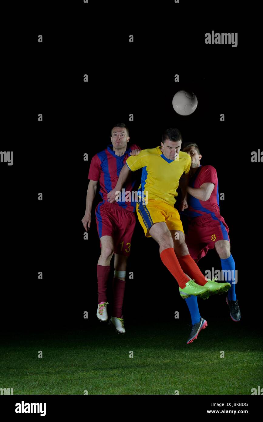 soccer player doing kick with ball on football stadium field isolated ...