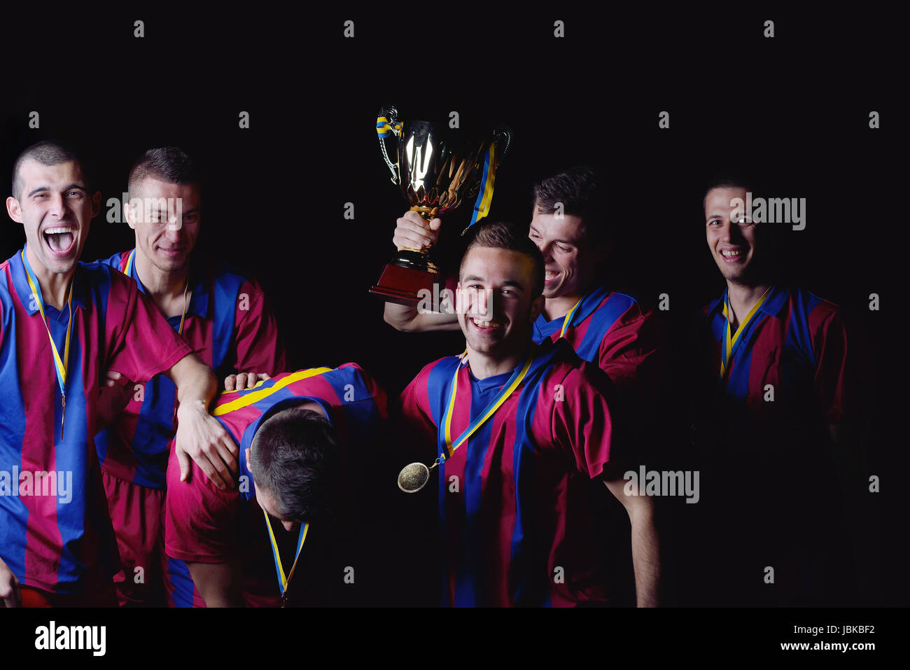 soccer players team group celebrating the victory and become champion ...