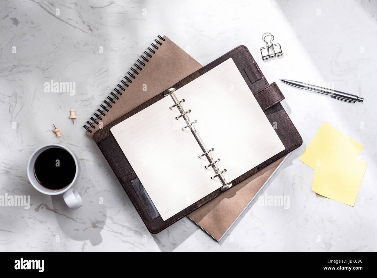 Flat lay, top view of open notebook and other supplies Stock Photo - Alamy