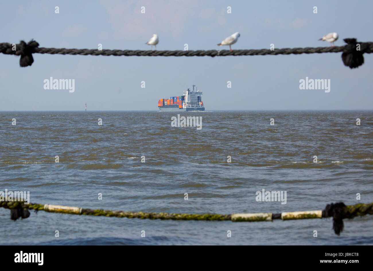 cargo ship in the distance Stock Photo - Alamy
