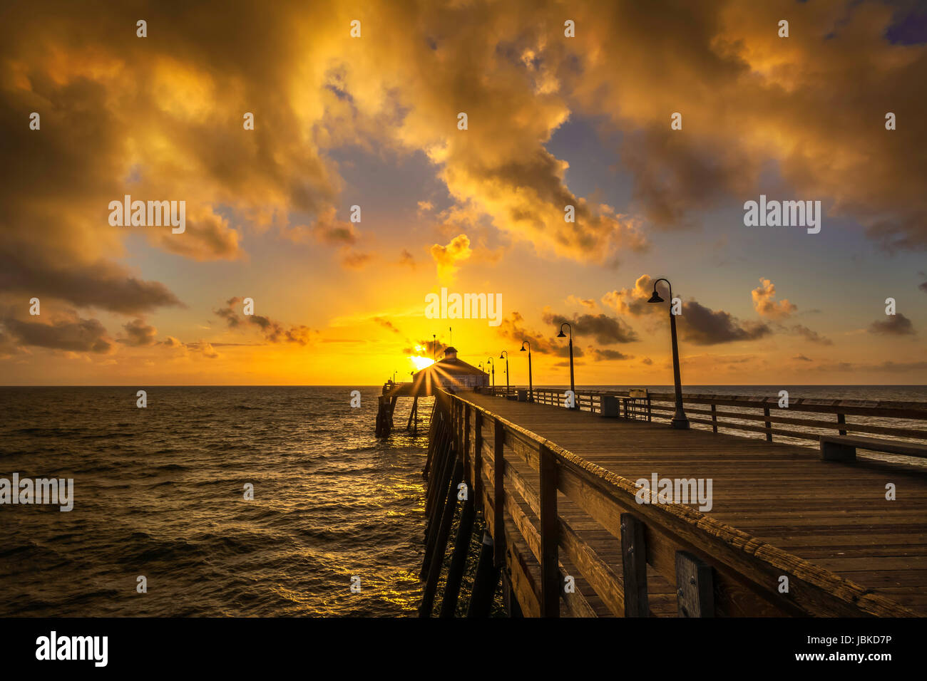 Sunset beach pier surfer hi-res stock photography and images - Alamy