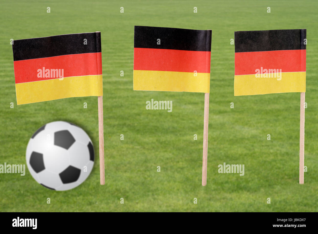 Soccer field with football and german flag Stock Photo - Alamy