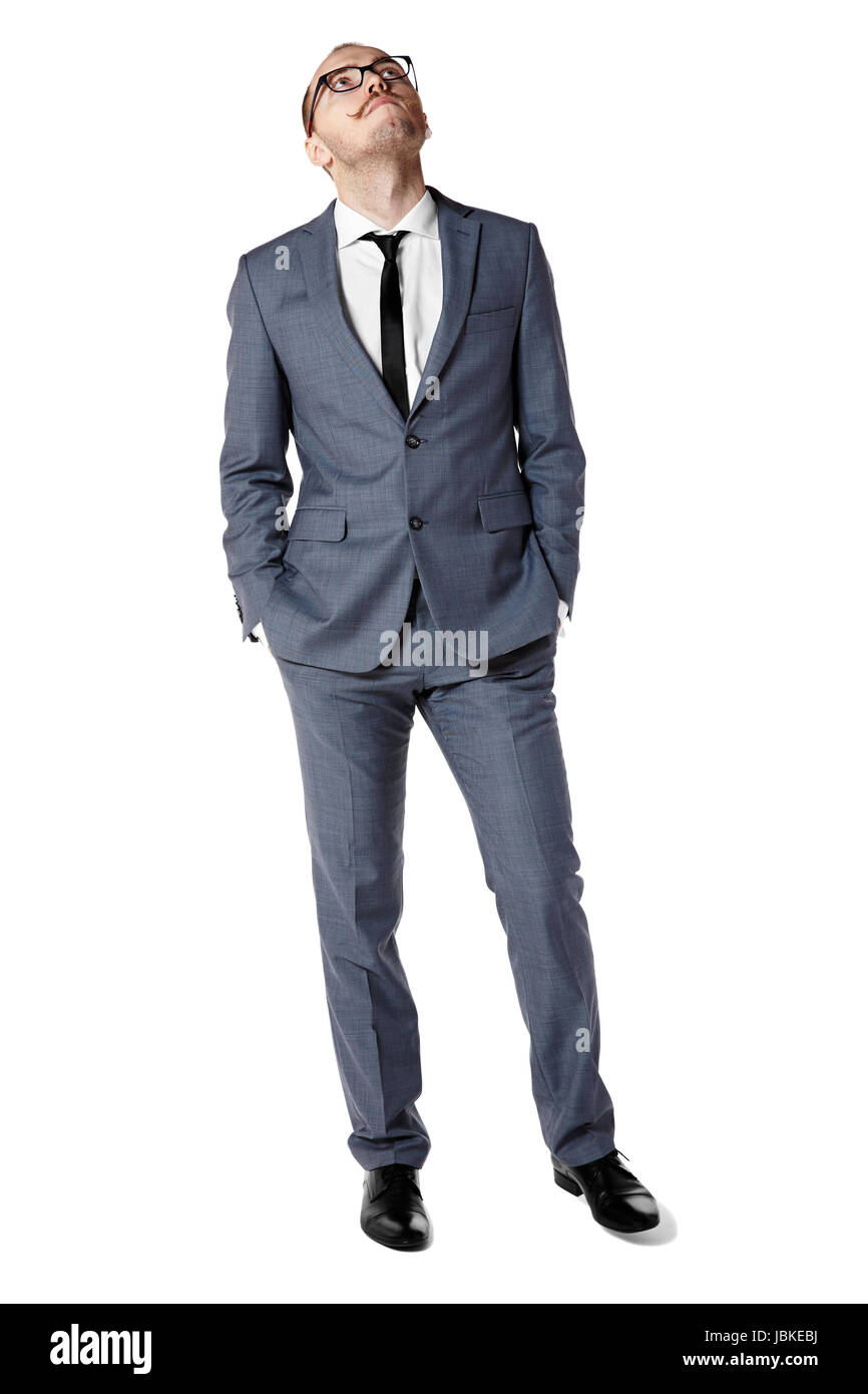 Young man looking up and wait for something. Hands in pockets Stock ...