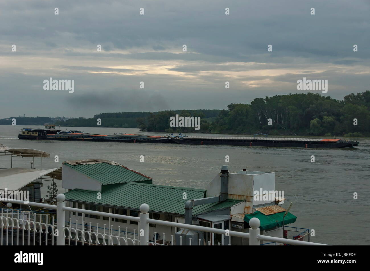 Pass tug-boat along pontoon and boats in the Vidin Danube port ...