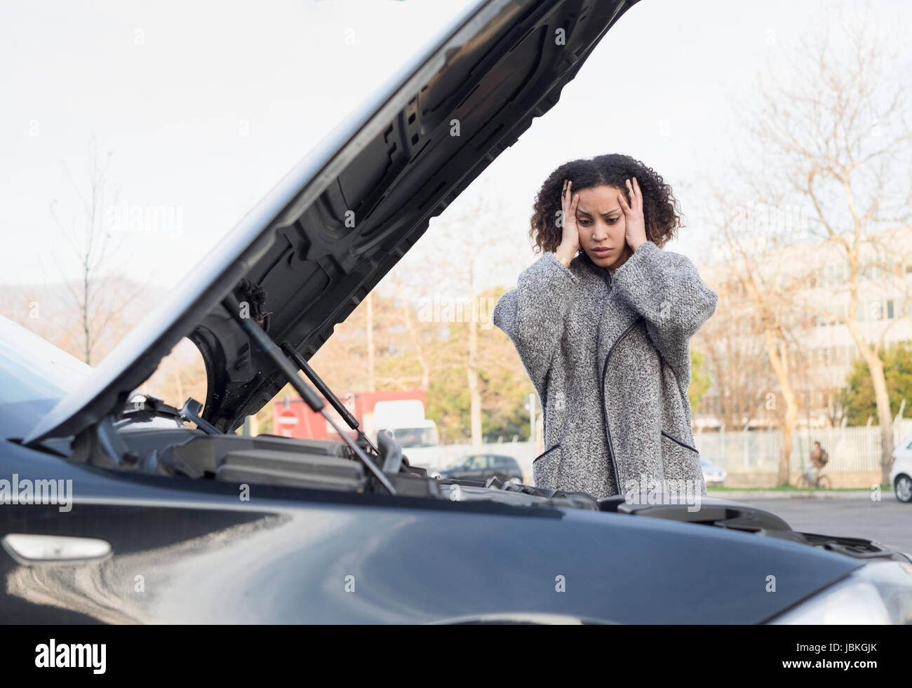 Girl looking broken down car hi-res stock photography and images - Alamy
