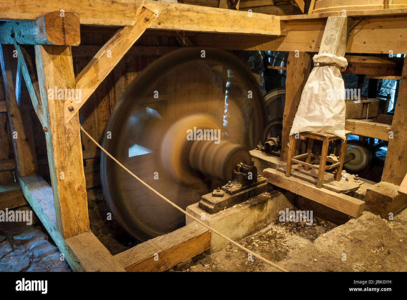wooden mill inside with equipment in operation Stock Photo - Alamy