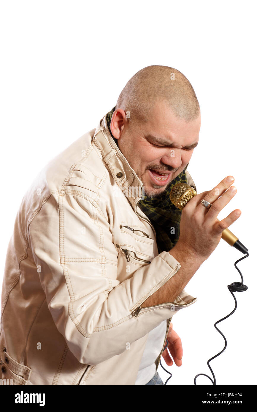 Rock singer sings into a microphone on white background Stock Photo - Alamy