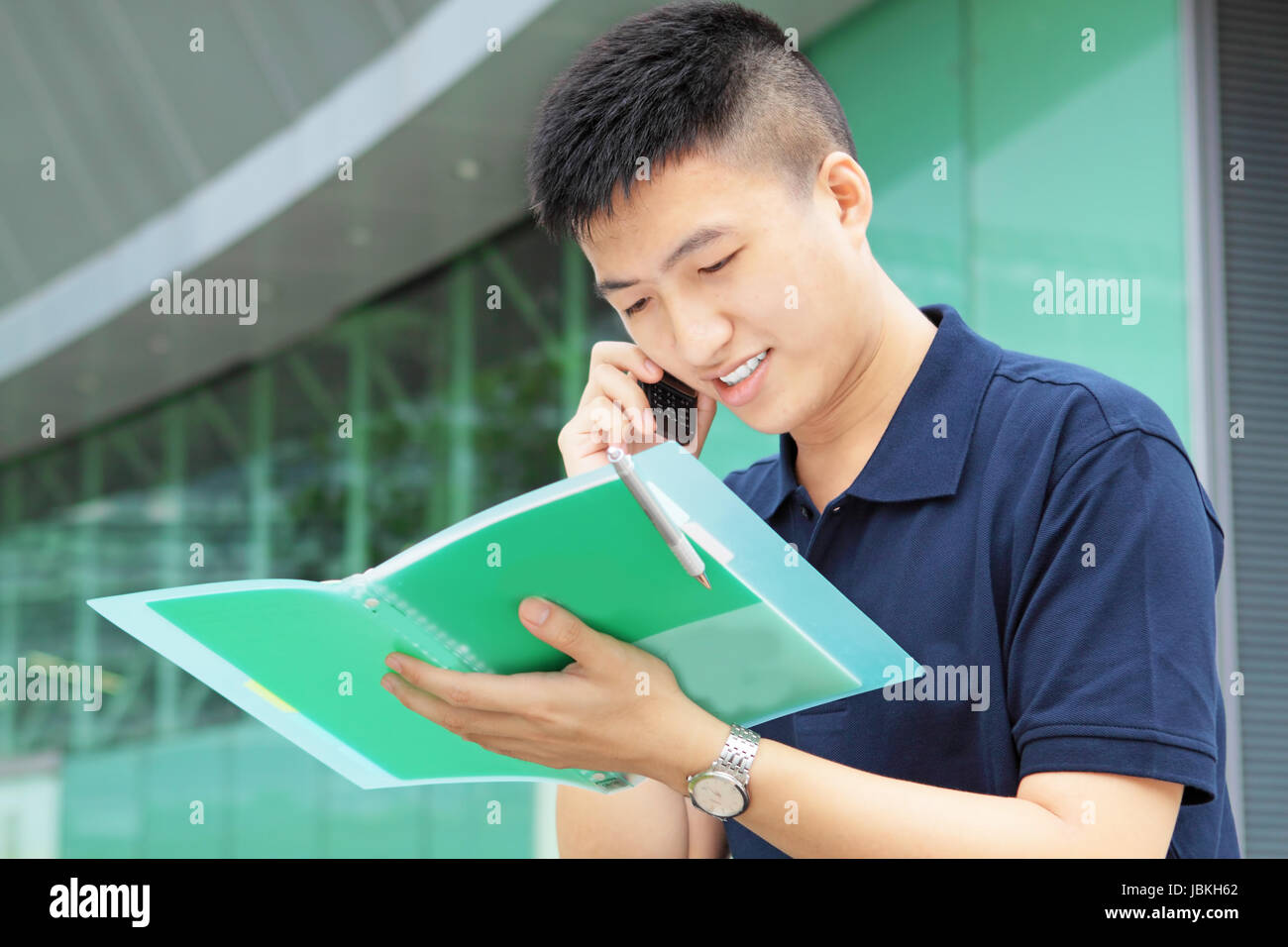 Portrait of businessman calling by phone Stock Photo - Alamy