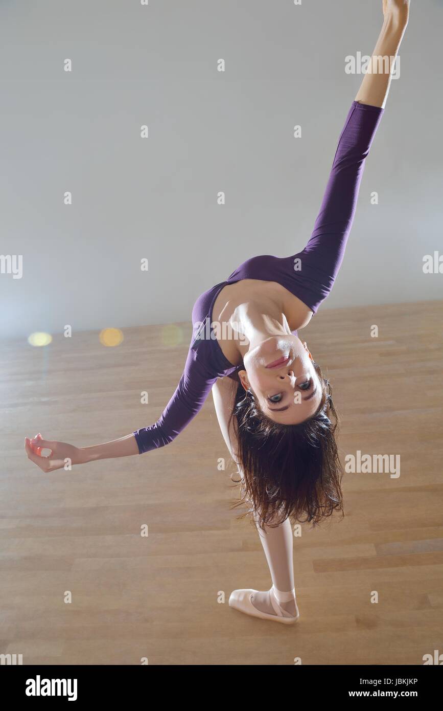 modern style ballet dancer posing and jumping on training Stock Photo ...