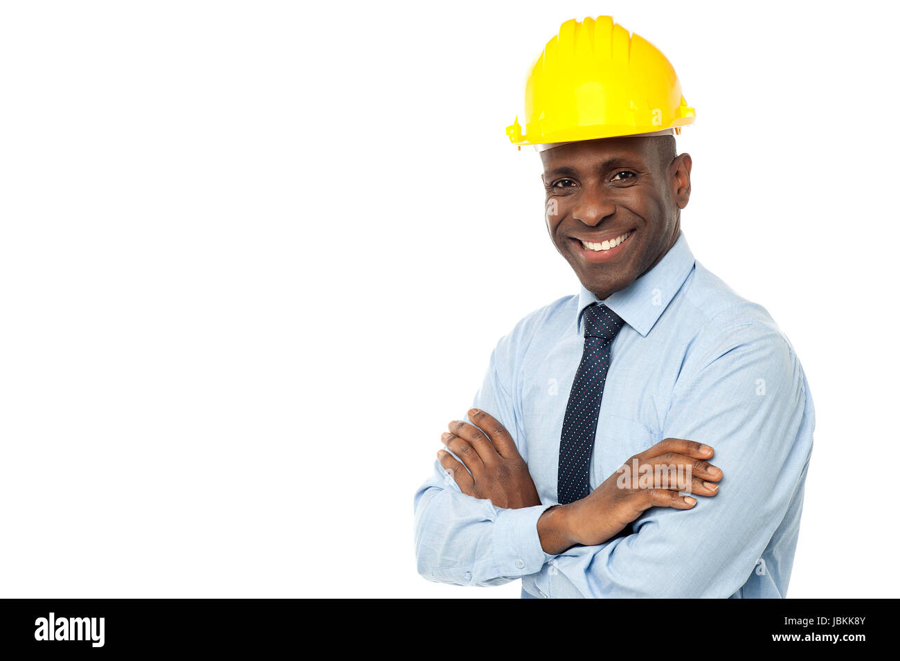 Construction engineer in hard hat with his arms crossed Stock Photo - Alamy