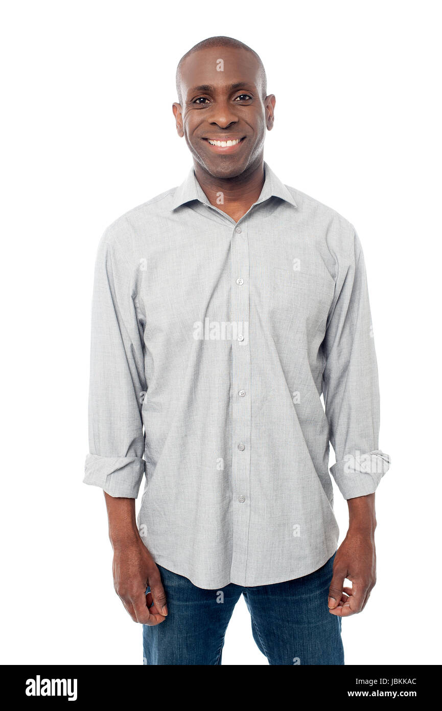 Smiling middle aged african man standing Stock Photo - Alamy