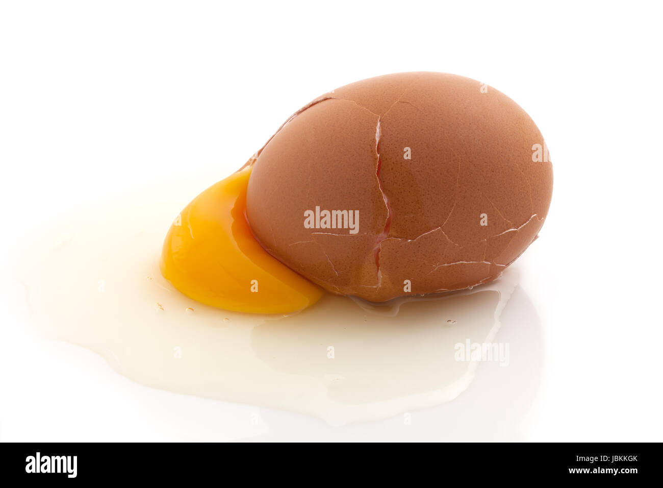 Broken egg on white background Stock Photo - Alamy