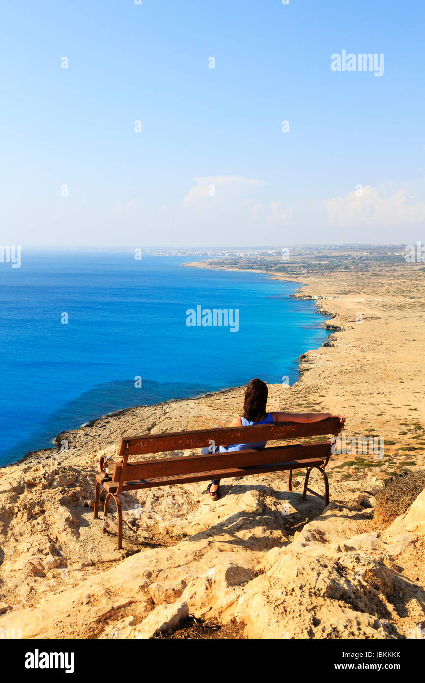 Girl sitting on cliff top hi-res stock photography and images - Alamy