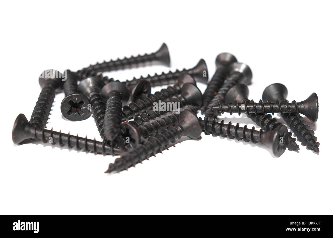 A group of many screws used as fasteners over white background Stock ...
